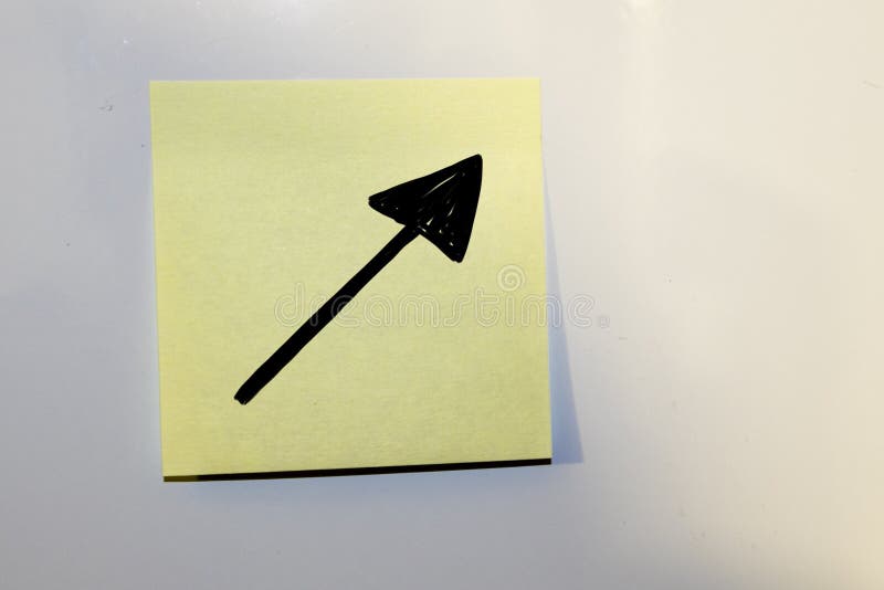 Post-it Note with an Arrow Written in Black Stock Image - Image of ...