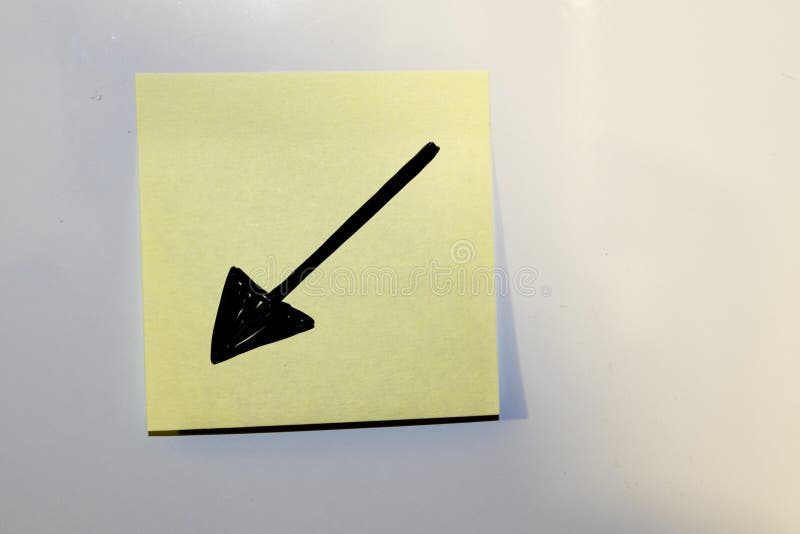 Post-it Note with an Arrow Written in Black Stock Image - Image of ...