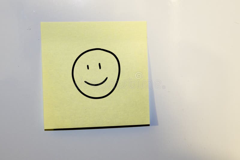 Post-it Note with a Happy Face Drawn Stock Image - Image of postit ...