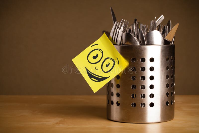 Post-it Note with Smiley Face Sticked on Cutlery Case Stock Photo ...