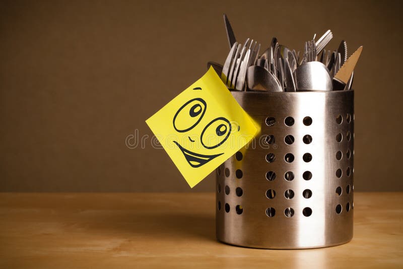 Post-it Note with Smiley Face Sticked on Cutlery Case Stock Photo ...