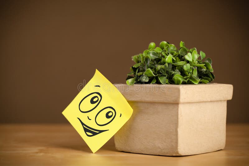 Post-it Note with Smiley Face Sticked on Flowerpot Stock Image - Image ...