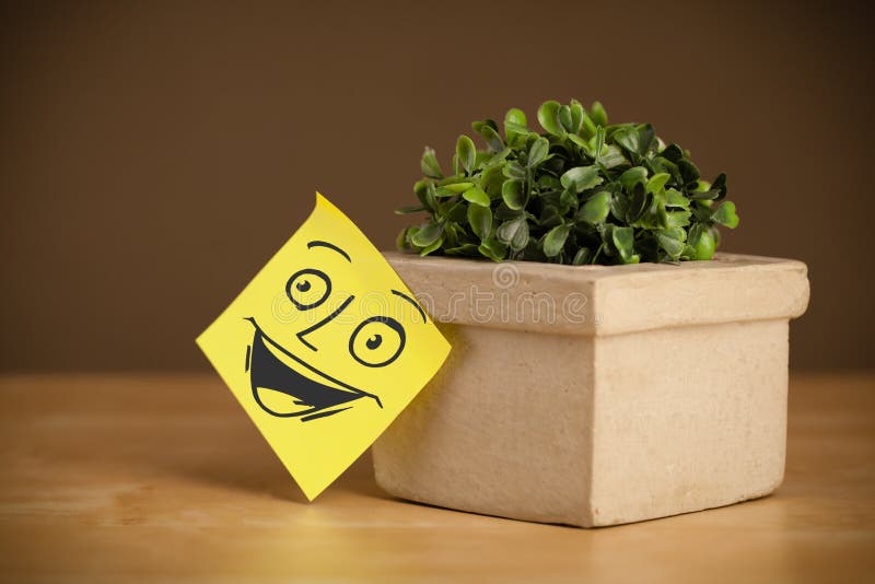 Post-it Note with Smiley Face Sticked on a Flowerpot Stock Image ...