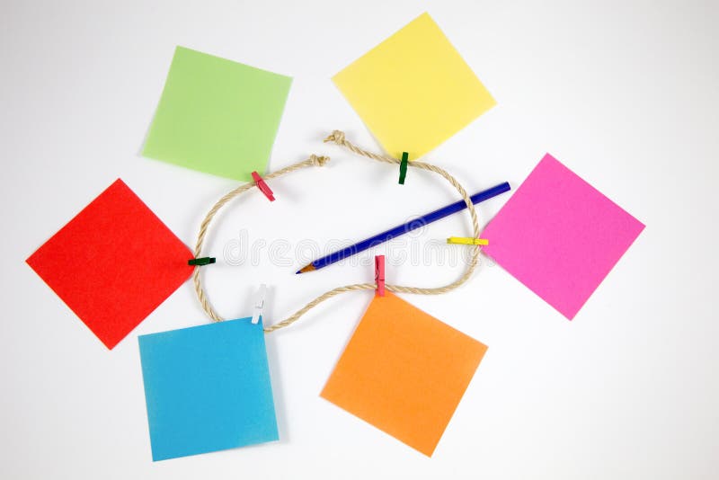 Post-it Notes with Small Colored Pegs in a Rope and a Blue Pencil Stock ...