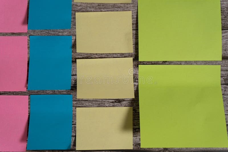 Post-it Notes and Sticky Notes Sorted by Color and Size on a Table ...