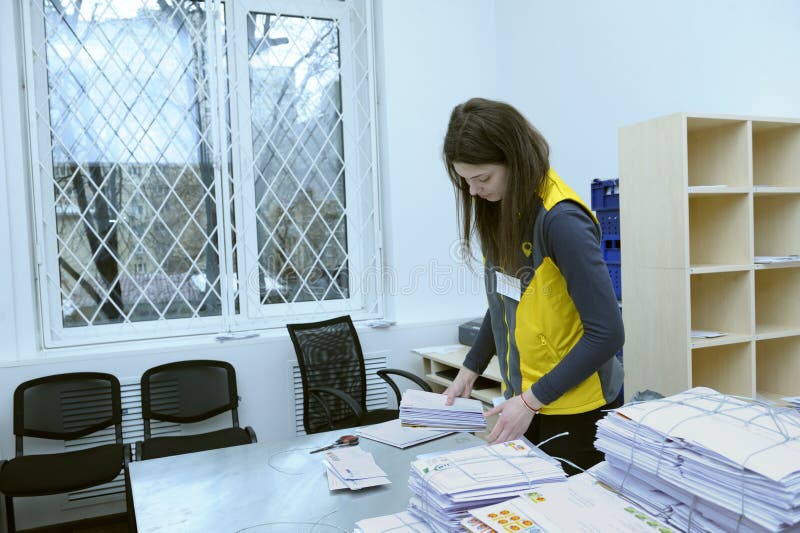 At the Post Office, Sorting Room: Young Woman Postal Worker in Uniform ...