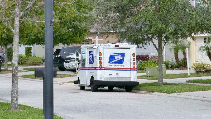 JP Post Mailman or Postman is on His Motorbike Moped or Motorcycle To ...