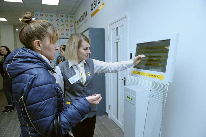 At the Post Office: Woman Postal Worker Consulting Client of Using ...