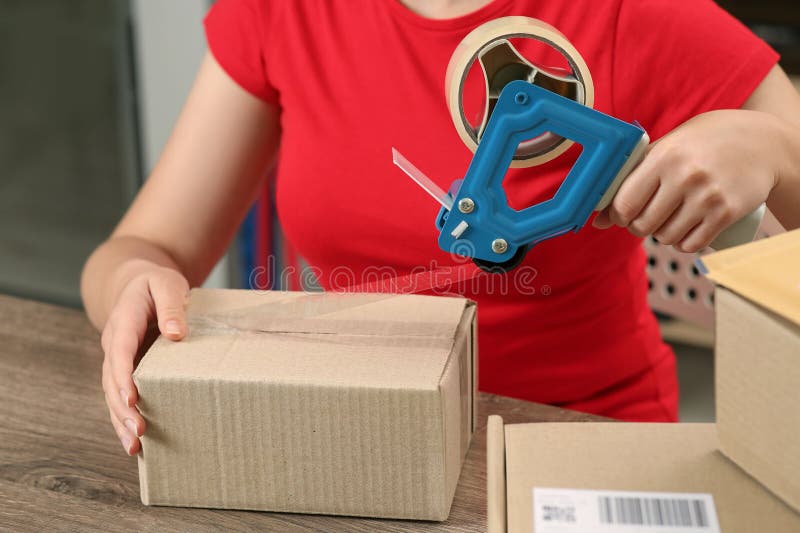Post Office Worker Sticking Barcode on Parcel at Counter Indoors ...