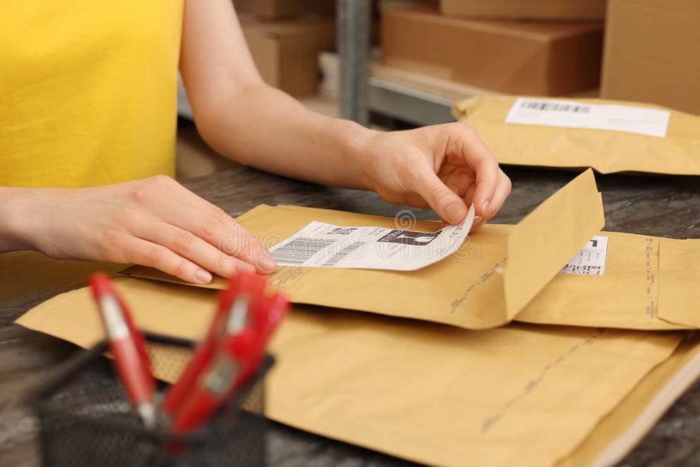Post Office Worker Sticking Barcode on Parcel at Counter Indoors ...