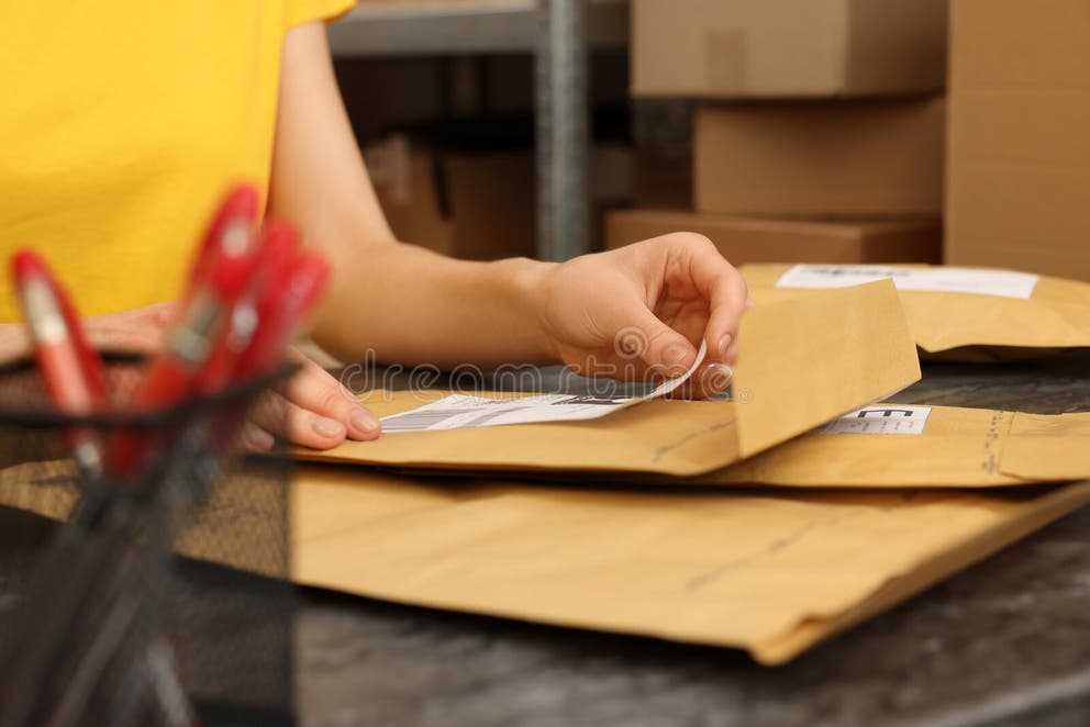 Post Office Worker Sticking Barcode on Parcel at Counter Indoors ...