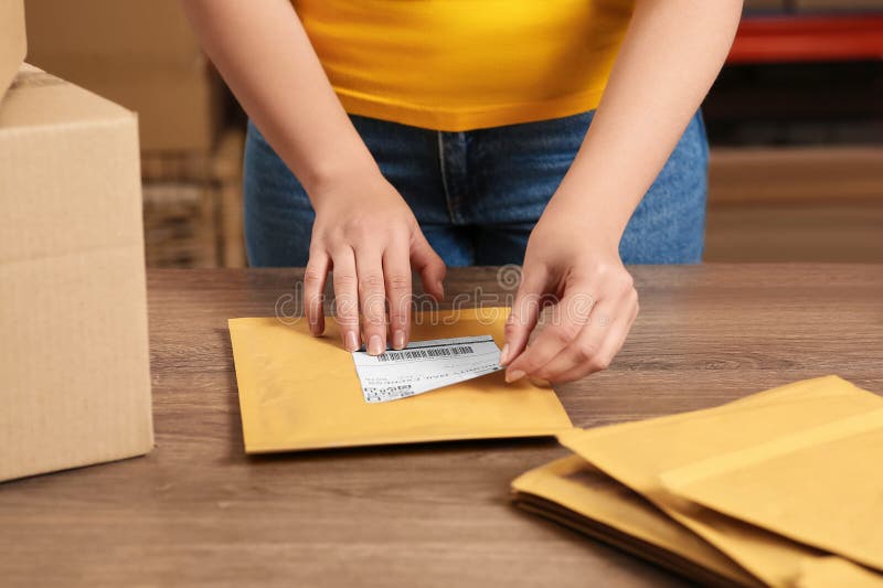 Post Office Worker Sticking Barcode on Parcel at Counter Indoors ...