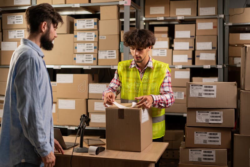 Post Office Worker Sticking Barcode on Parcel at Counter Indoors ...