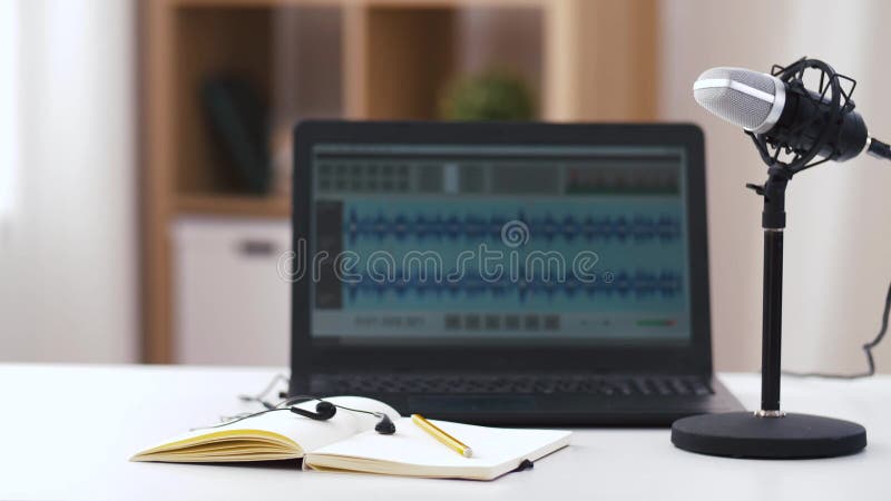 Microphone, Laptop, Earphones on Notebook on Table Stock Footage ...