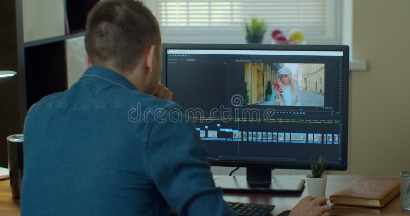 Post Production and Vlog Concept - Man Working in Video Editor Program ...