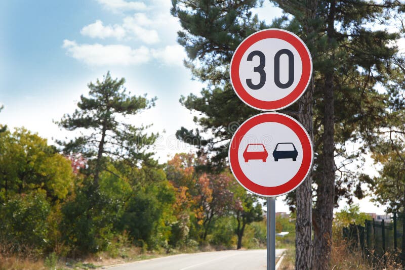 Post with Road Signs Maximum Speed 30 and No Overtaking Outdoors. Space ...