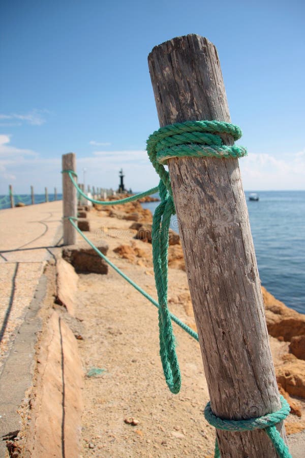 Post with a Rope and Pierce Stock Photo - Image of ocean, coastal: 66458700