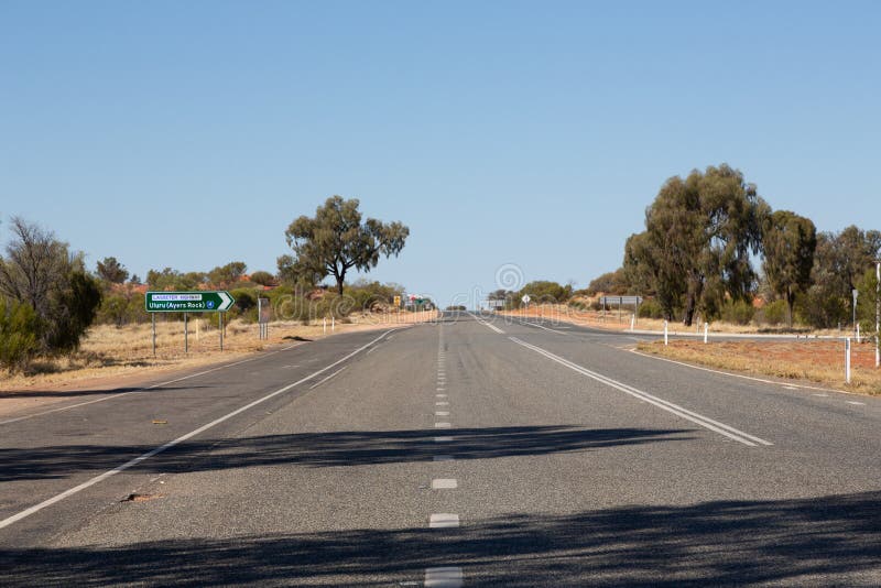 A Post Sign To Uluru, Ayers Rock, Lasseter Highway, Australia Stock ...