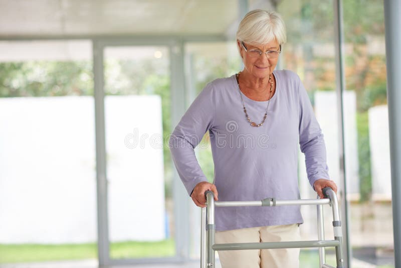 Post-surgery Exercise is Essential. a Senior Woman Walking with Care ...