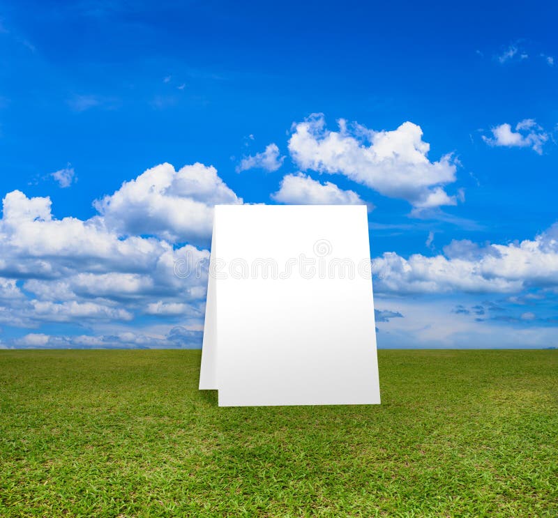 Poster Standing on Green Field Under Blue Clouds Sky. Stock Photo ...