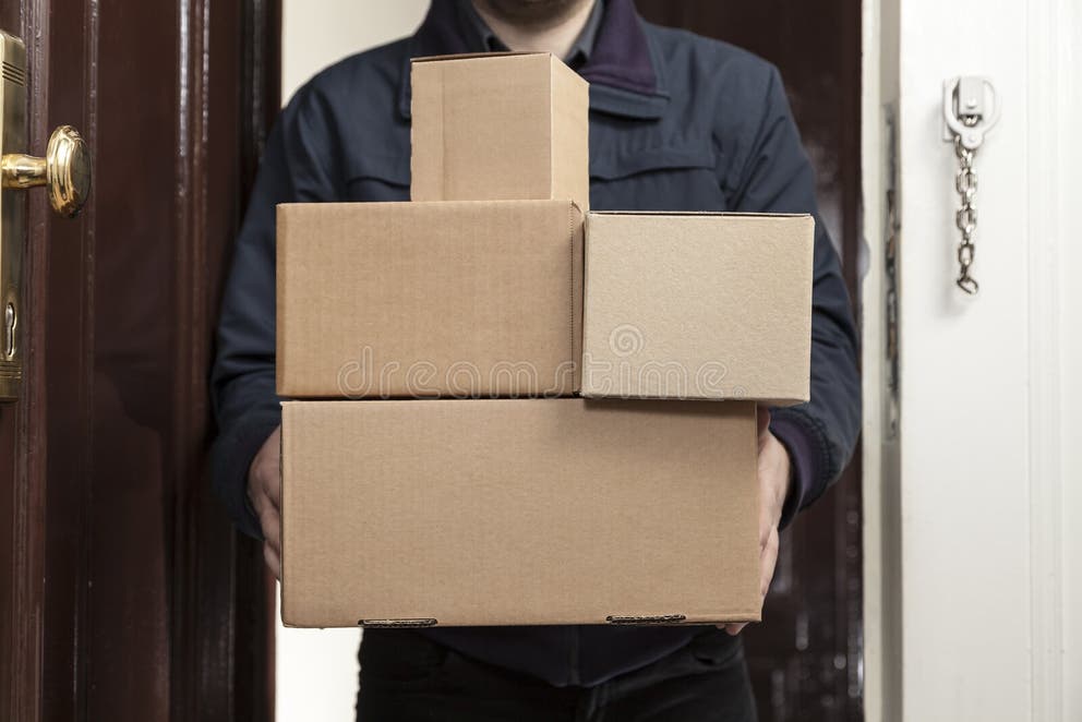 Postman Brings with Packages Stock Photo - Image of packet, lots: 61511722