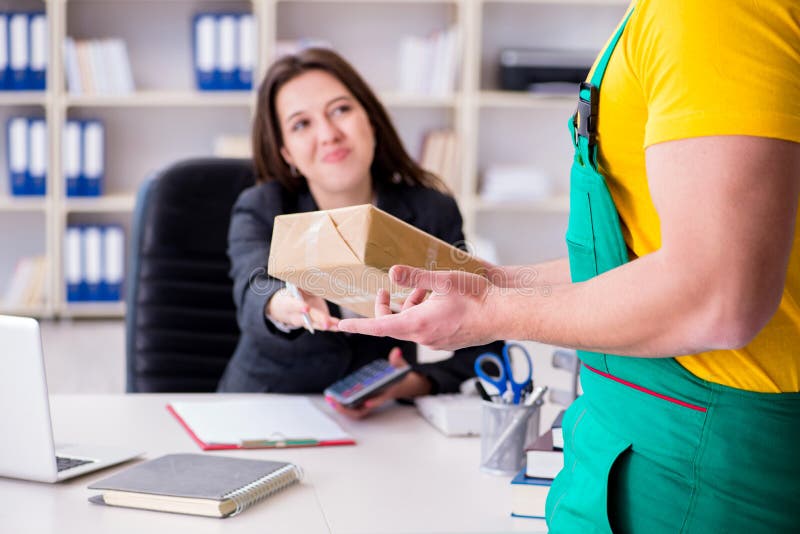 The Postman Delivering Parcel To the Office Stock Image - Image of male ...