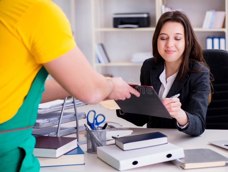 Postman Delivering Parcel To the Office Stock Photo - Image of ...