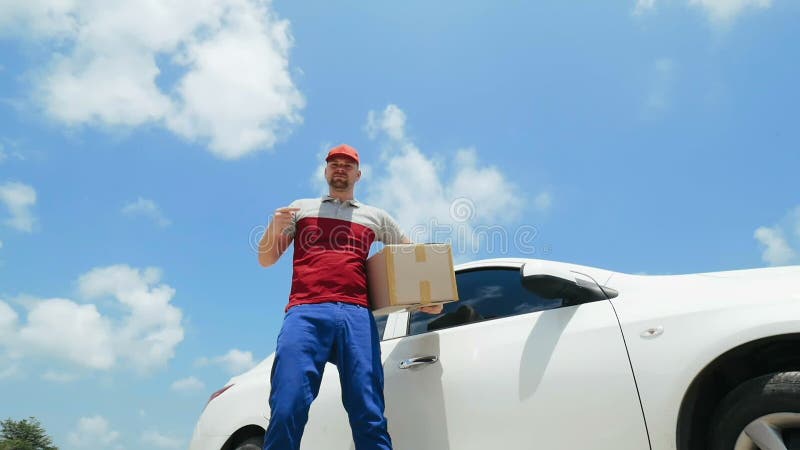 Postman in Uniform Twists and Throws a Box. Stock Video - Video of ...