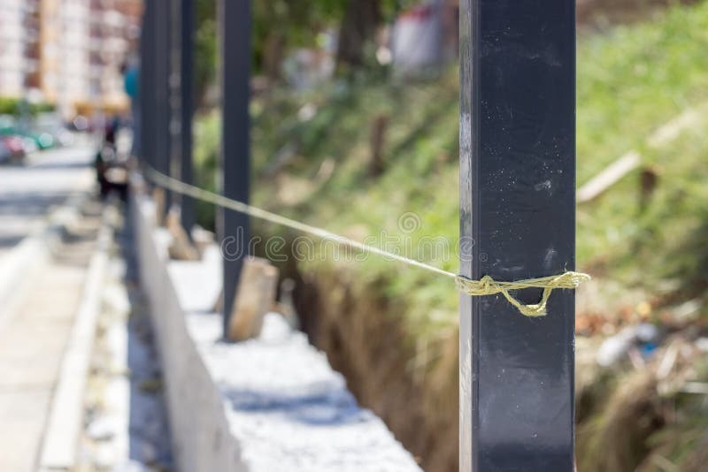 Posts into Holes with a String Line Stock Photo - Image of private ...