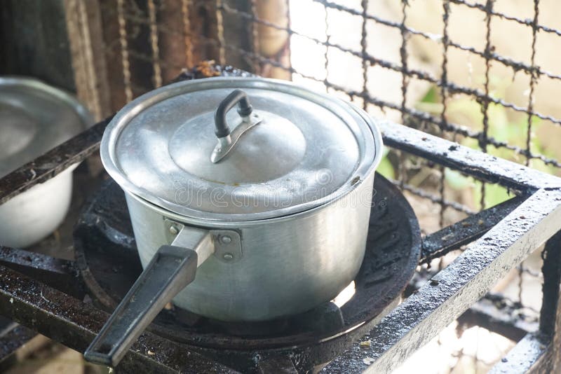 Pot boiled on fire stove stock photo. Image of closeup - 237938554