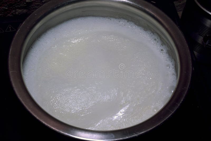 Pot Boiling Fresh Milk for Consumption, Boiling Milk at Induction Store ...