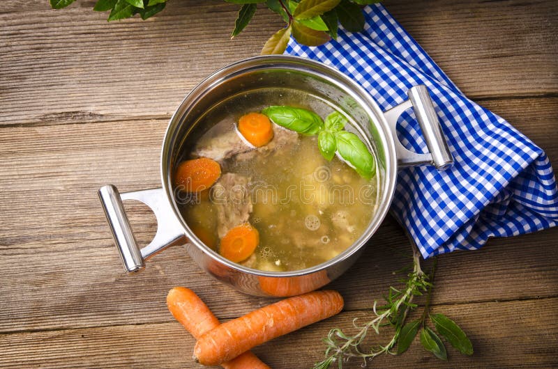 Pot with broth stock image. Image of basil, ingredients - 23883583