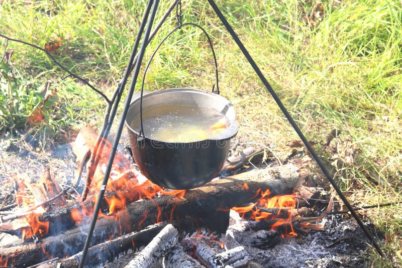 Pot for cooking on a fire stock image. Image of cooking - 118627099