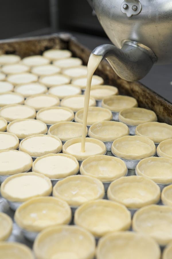 Pot Filling Egg Pudding into Row of Puff Stock Image - Image of tarts ...
