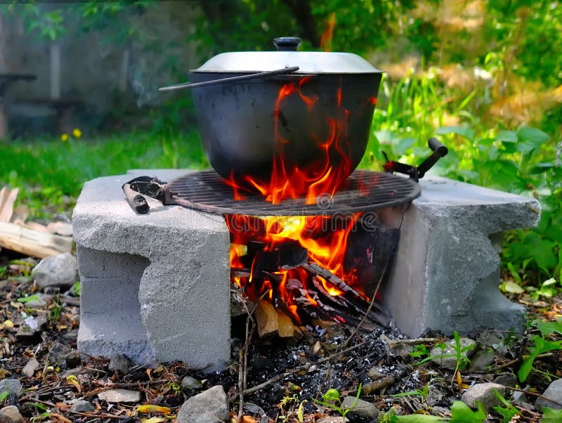 Pot on the fire outdoors stock image. Image of flame - 69261193