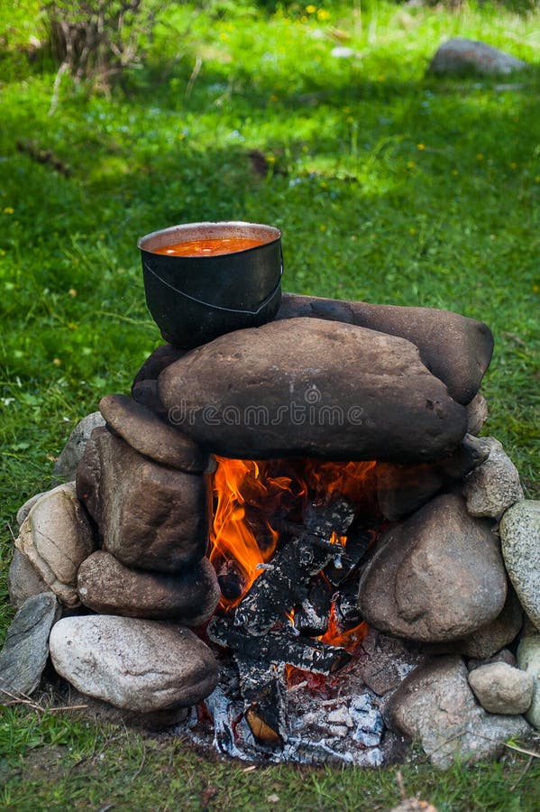 A Pot of Food at the Stake. Stove from Stones. Stock Image - Image of ...