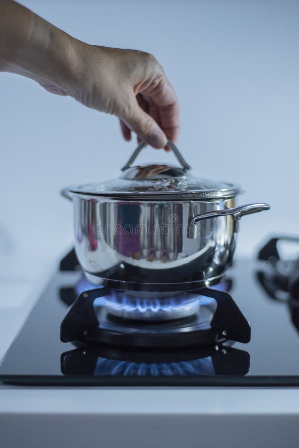 Pot on Gas Stove, Cooking on a Gas Stove Stock Photo - Image of black ...