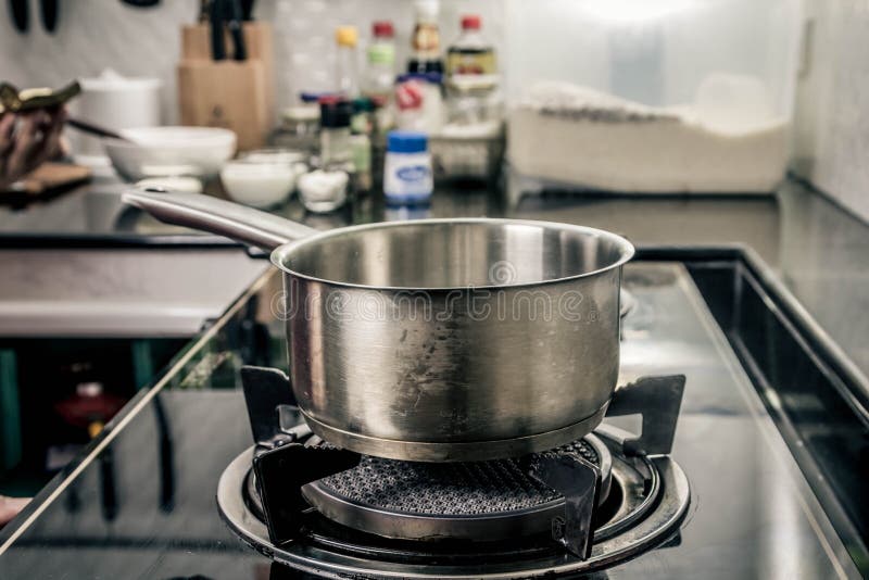Pot on gas stove stock photo. Image of food, utensil - 66494030
