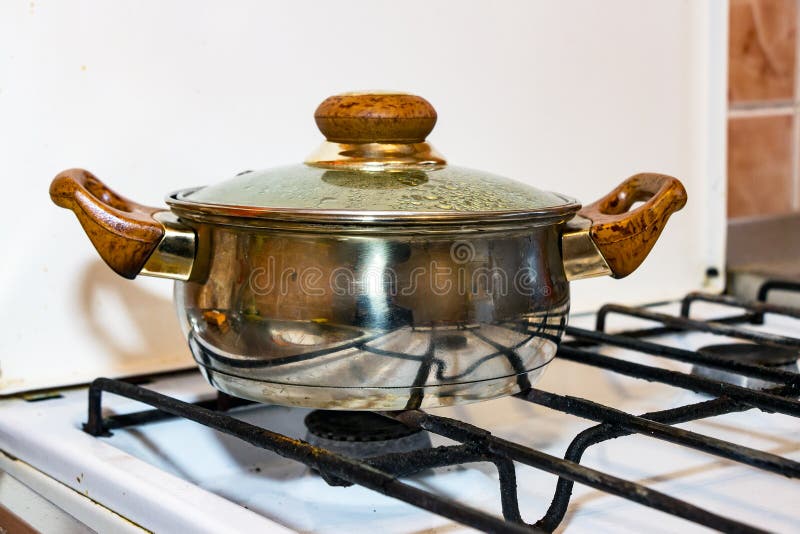 Pot on a gas stove stock photo. Image of modern, casserole - 108370686