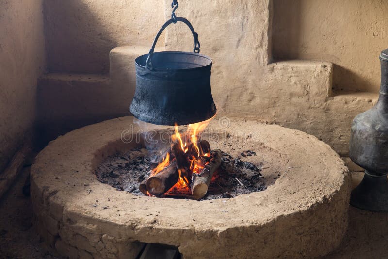 Pot hanging over the fire stock photo. Image of wood - 65947706