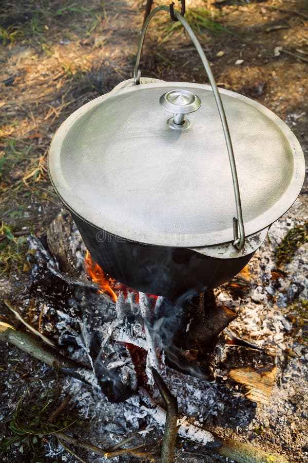 A Pot Hanging on a Tripod Over the Fire Stock Image - Image of camp ...