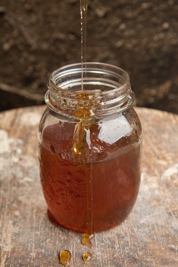 Pot of honey stock image. Image of falling, white, natural - 16633407