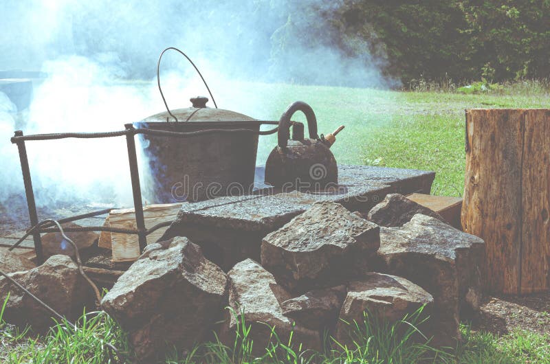 Cooking on a Campfire. Pot and Kettle on the Fire Stock Photo - Image ...