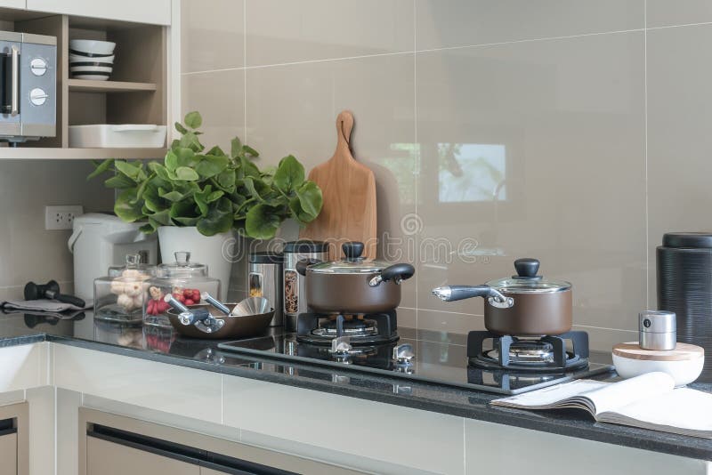 Pot with Oven on Black Granite Counter Stock Photo - Image of hood ...