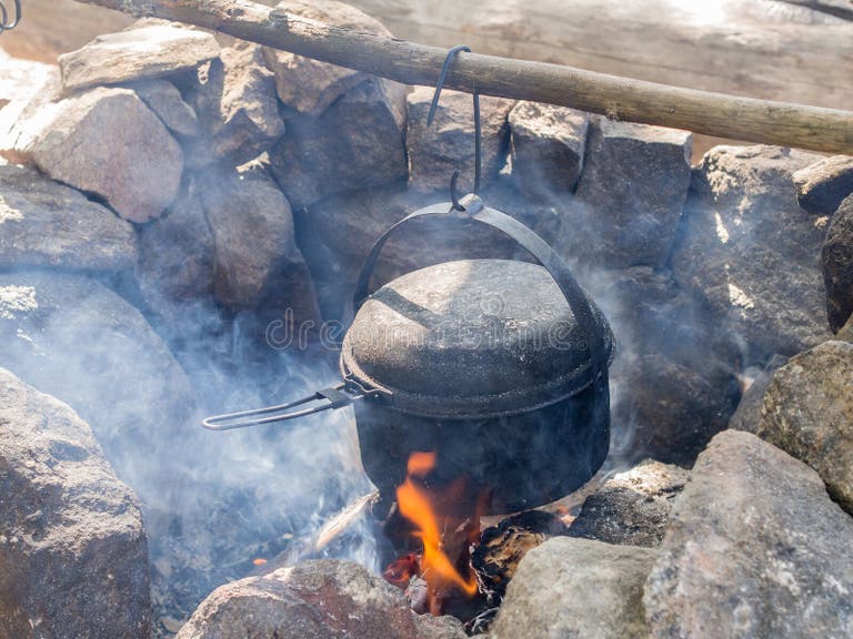 Pot over a fire stock photo. Image of heat, wood, stone - 75417188