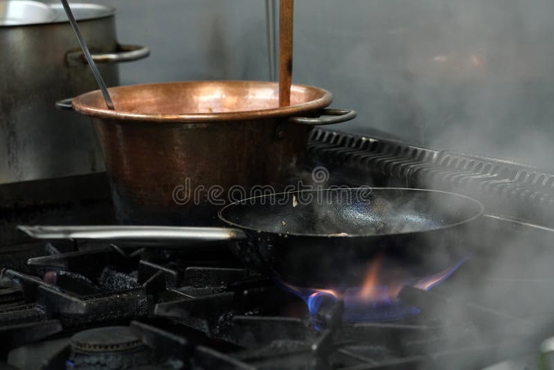 Pot and Pan on the Fire of a Real Kitchen Stock Photo - Image of ...