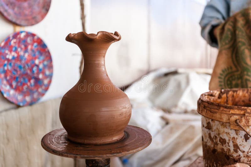 Pot on the pottery wheel stock photo. Image of handicraft - 79772646