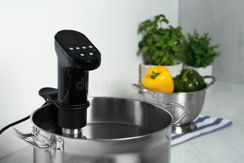 Pot with Sous Vide Cooker in Kitchen, Closeup. Thermal Immersion ...