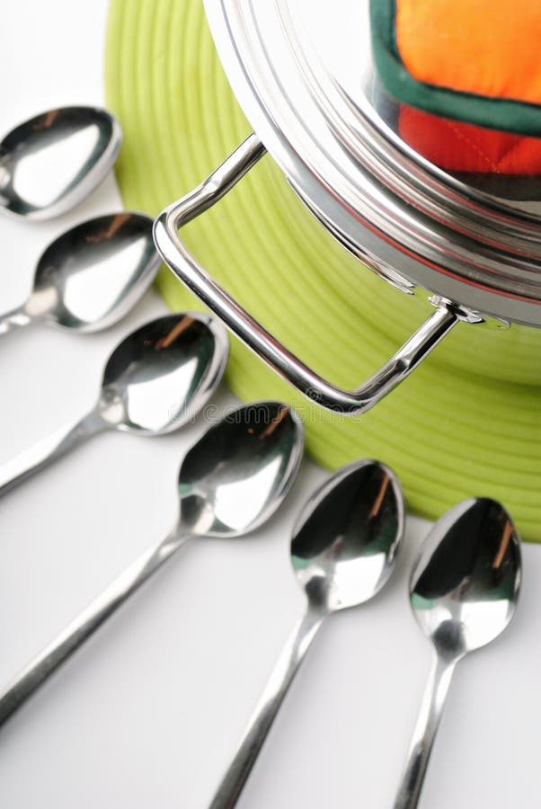 Pot and Spoons stock image. Image of shiny, orange, stand - 15302821