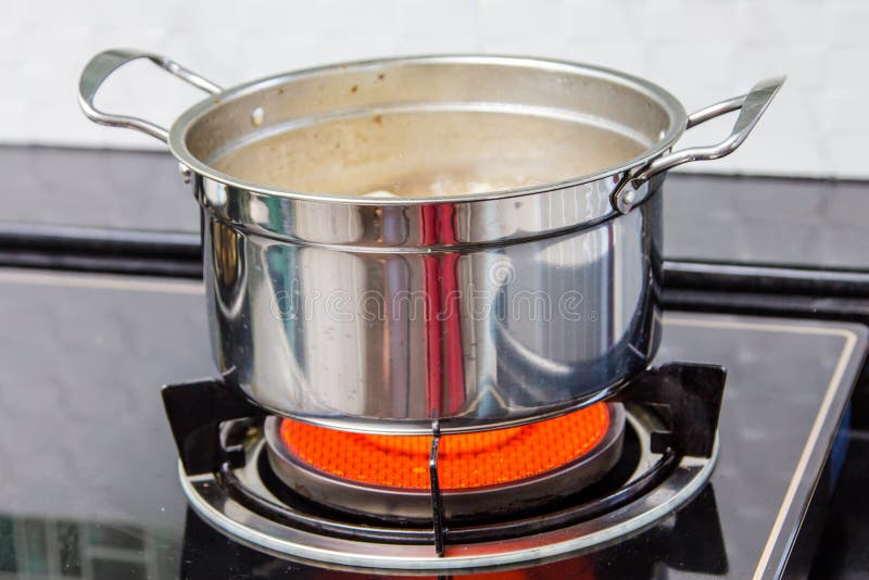 Pot on stove stock photo. Image of cooker, fire, colander - 56757530